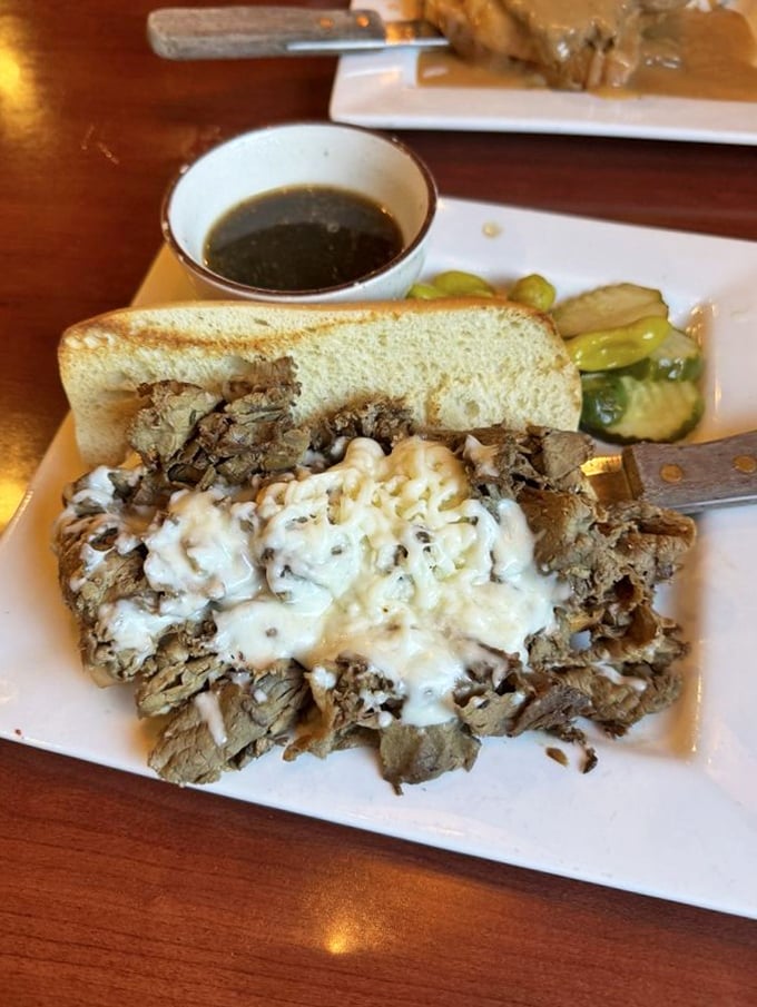 This isn't just Italian beef—it's a masterpiece of tender meat and melted cheese, with pickled peppers standing guard.