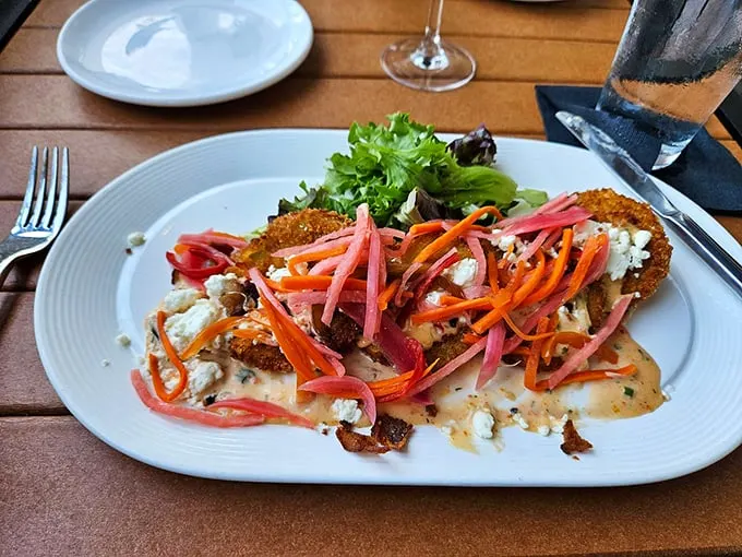 These aren't your grandma's fried green tomatoes – unless your grandma's secretly a gourmet chef! A Southern classic with a zesty twist. Photo credit: JKL