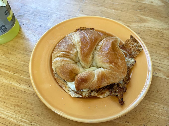 Croissant dreams are made of this! Golden, flaky, and stuffed with goodness – it's the breakfast sandwich that puts the 'rise' in sunrise.