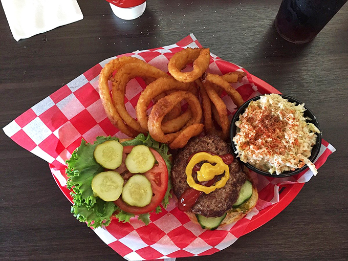 The dynamic duo: a juicy burger and golden onion rings. It's like Batman and Robin, if they were delicious and didn't fight crime.