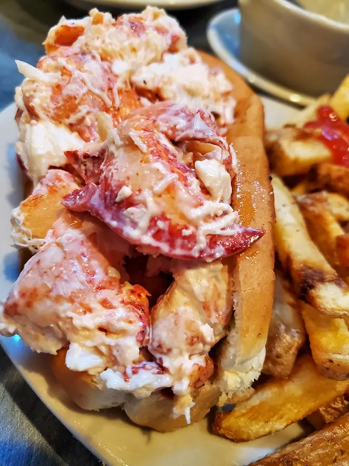 Behold, the lobster roll of legends! This isn't just a sandwich; it's a work of art that belongs in the Louvre… if the Louvre allowed snacking.