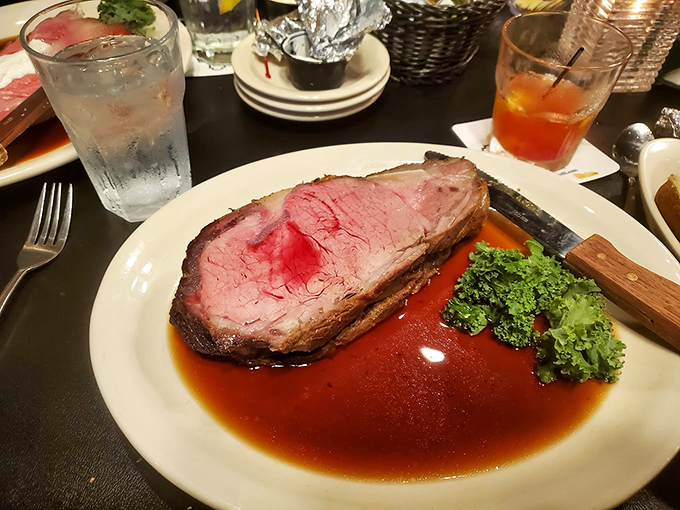 Behold, the pièce de résistance! This prime rib is so tender, you could probably cut it with a stern look. It's the kind of meat that makes vegetarians question their life choices.