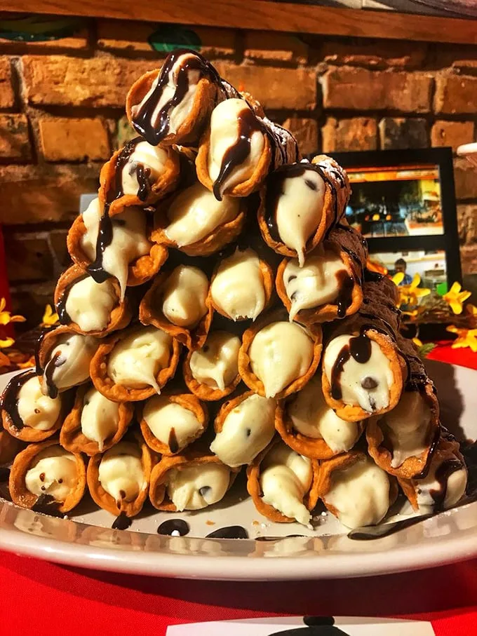 Behold the leaning tower of sweetness! These cannoli aren't just dessert, they're an edible work of art that would make Michelangelo weep with joy.