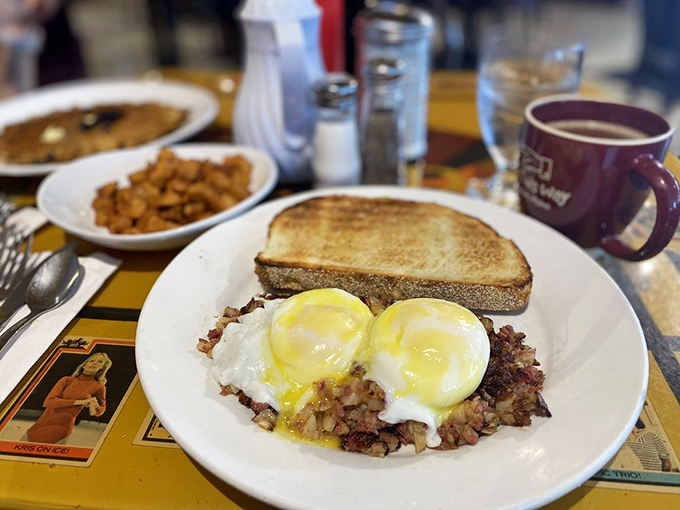The holy trinity of breakfast: perfectly poached eggs, house-made corned beef hash, and golden sourdough toast. Heaven on a plate. Photo credit: Kristen K.