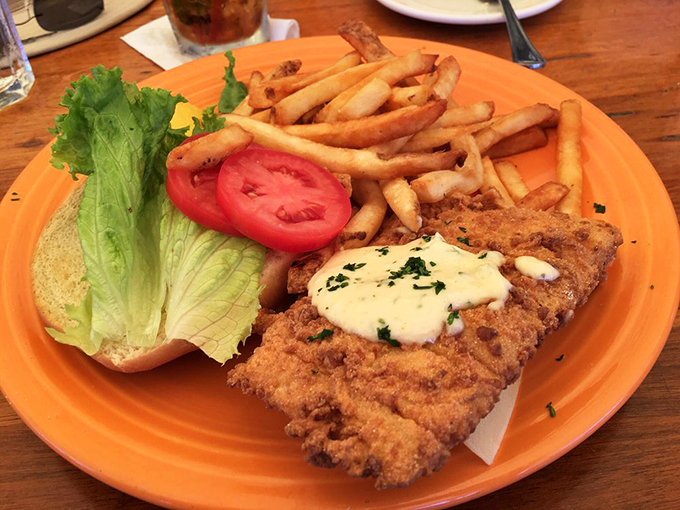 This isn't just a sandwich – it's a seafood masterpiece with crispy haddock, fresh toppings, and enough fries to share (but you won't want to). Photo credit: Alden D.