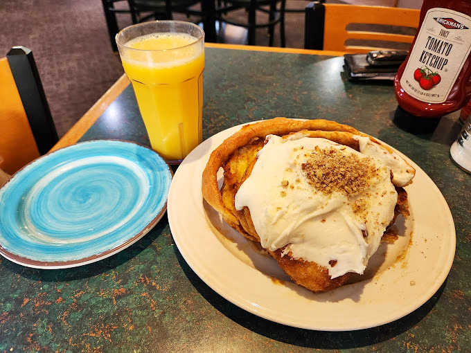 Behold, the cinnamon roll that ate Manhattan! This gooey giant is what would happen if a hug and a sugar rush had a delicious baby.