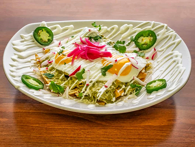 Layers of crispy, saucy, cheesy goodness. It's like a breakfast fiesta threw up on your plate - in the best way possible.