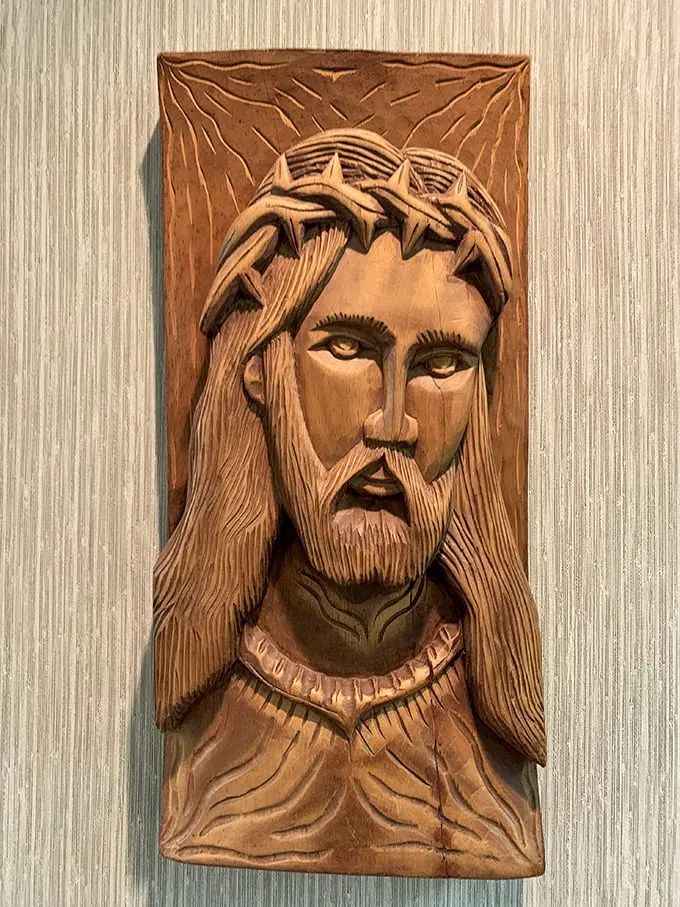 Face to face with the divine! This intricate wood carving of Jesus is so lifelike, you'll swear those eyes follow you around the room.