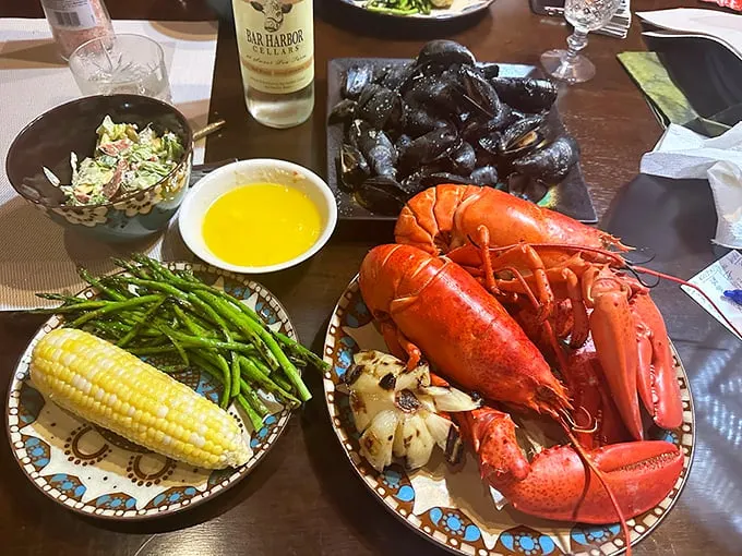 When land meets sea: perfectly steamed mussels share the spotlight with a lobster that's dressed for dinner. Photo credit: dayna boyce