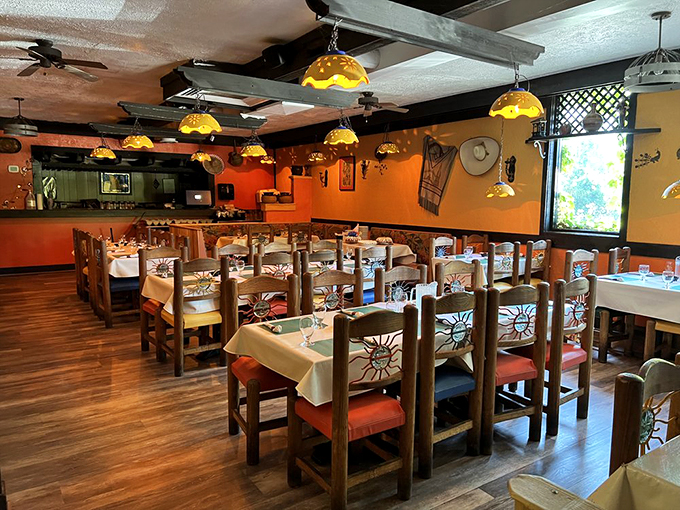 Hand-carved chairs and sun-dappled lighting transform this dining room into a cozy corner of Mexico, right here in Illinois.