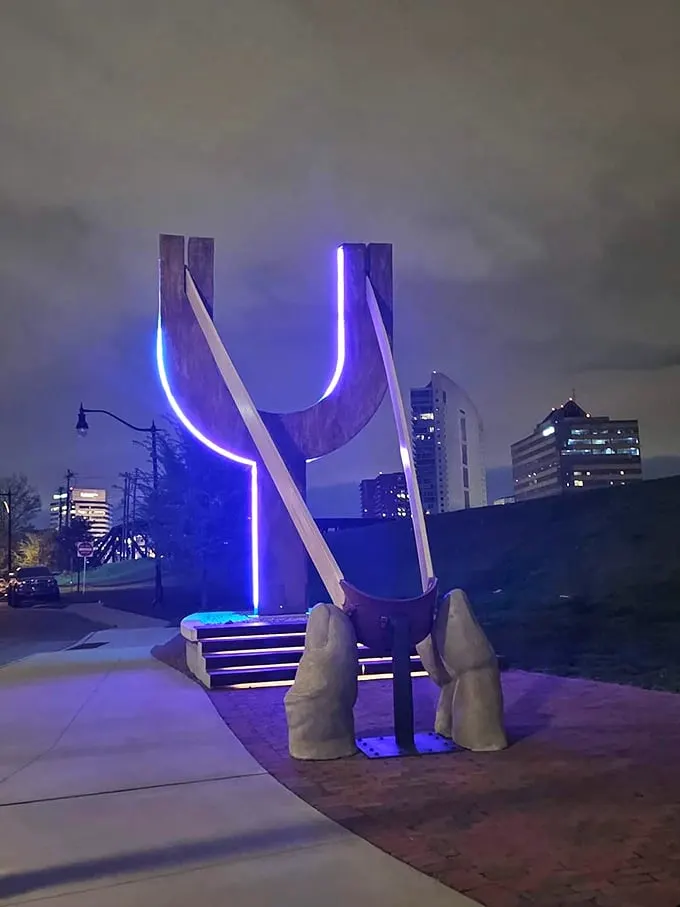 By night, it transforms into a neon dream. Who needs Times Square when you've got this glowing giant in your backyard?