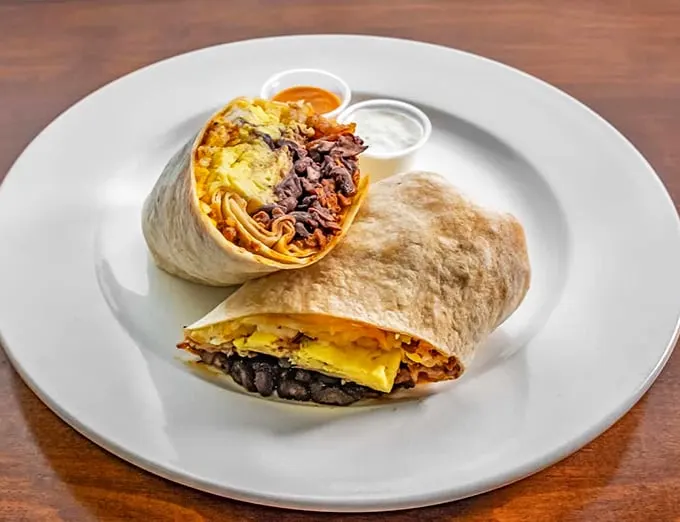This burrito is so big, it needs its own zip code. It's not just a meal, it's a commitment to deliciousness.