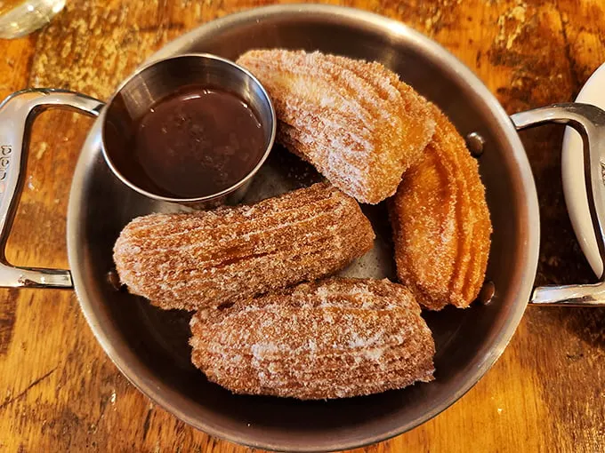 Churros: The reason diets were invented to be broken. These golden twists of perfection are what cinnamon-sugar dreams are made of.