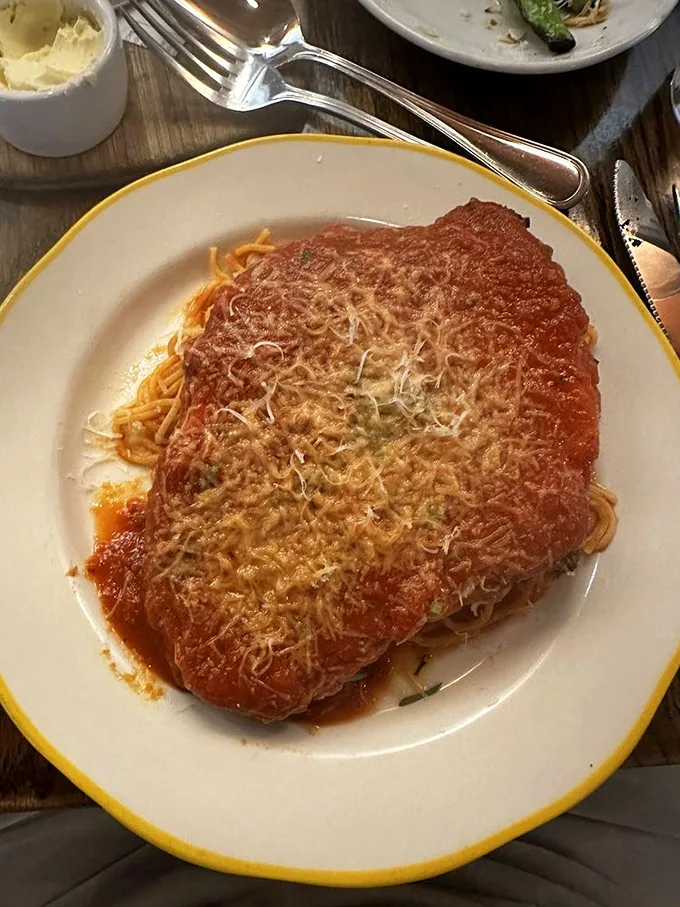 This chicken parm isn't just a dish, it's a work of art. Golden, crispy, and smothered in sauce and cheese—it's comfort food that gives you a warm hug.