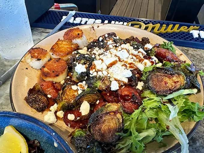 A plate that screams "treat yo' self!" Scallops and Brussels sprouts: the unlikely duo that became the Starsky and Hutch of seafood dishes. Photo credit: Trey Butler