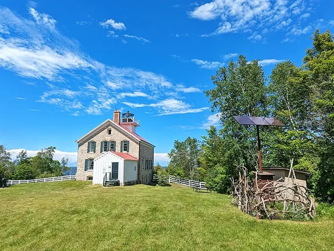 Historic lighthouse stands sentinel over waters that have witnessed centuries of maritime tales and Door County sunsets.