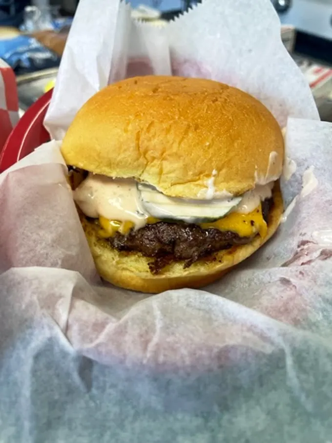 Meet the burger that'll make you forget all about your diet resolutions. It's not just a meal; it's a handheld flavor explosion.