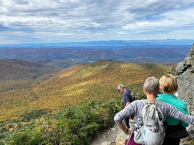 Summit selfie time! These hikers look like they've just conquered Everest, but with better cell reception and less risk of frostbite.