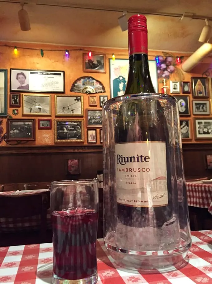Cin cin! Nothing says "la dolce vita" quite like Lambrusco on a red-checkered tablecloth. It's not just wine, it's liquid vacation.