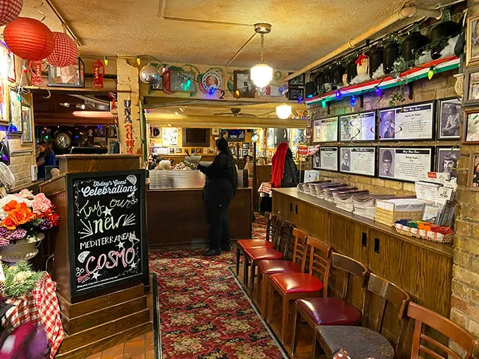 Welcome to the heart of the hustle! This front desk is where pasta dreams come true. Notice the chalkboard – it's whispering sweet nothings about today's specials.