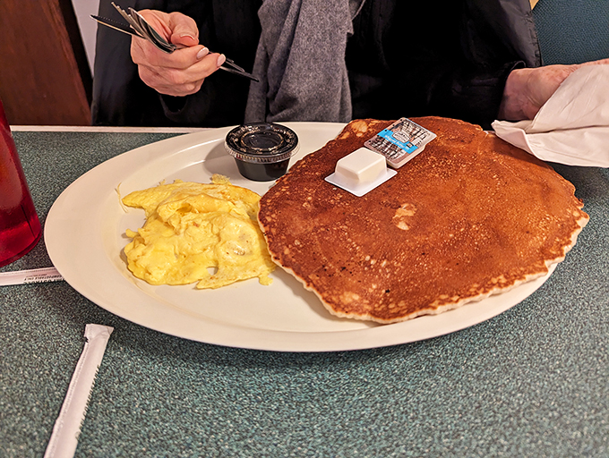 Behold, the pancake of your dreams – so fluffy it might float away if not anchored by maple syrup.