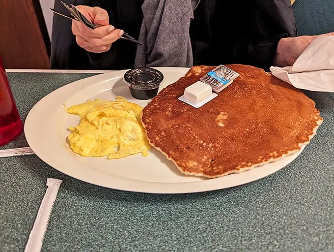 Behold, the pancake of your dreams – so fluffy it might float away if not anchored by maple syrup.