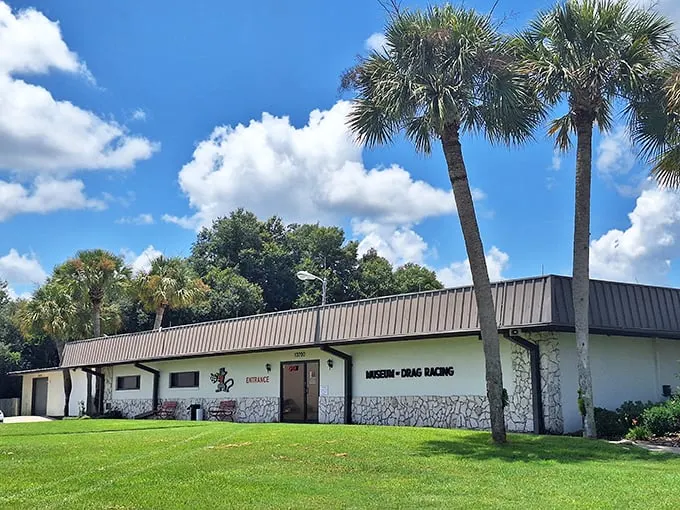 Palm trees and promise! This unassuming exterior hides a treasure trove of automotive history that'll rev up your enthusiasm faster than a nitro-fueled dragster.