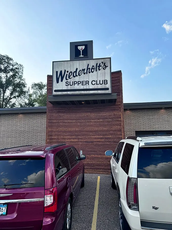 A neon martini glass winks at you from above – Wiederholt's Supper Club is ready to shake up your evening, one classic cocktail at a time.