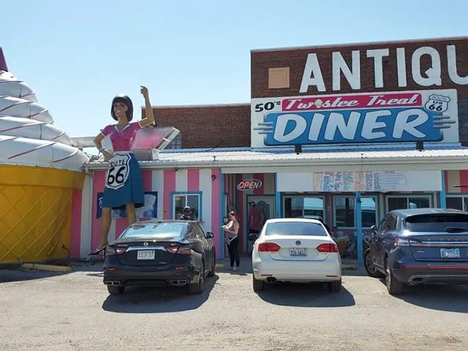 Step right up to the Pink Elephant Antique Mall! With its giant ice cream cone and retro diner, it's like a time machine disguised as a building.