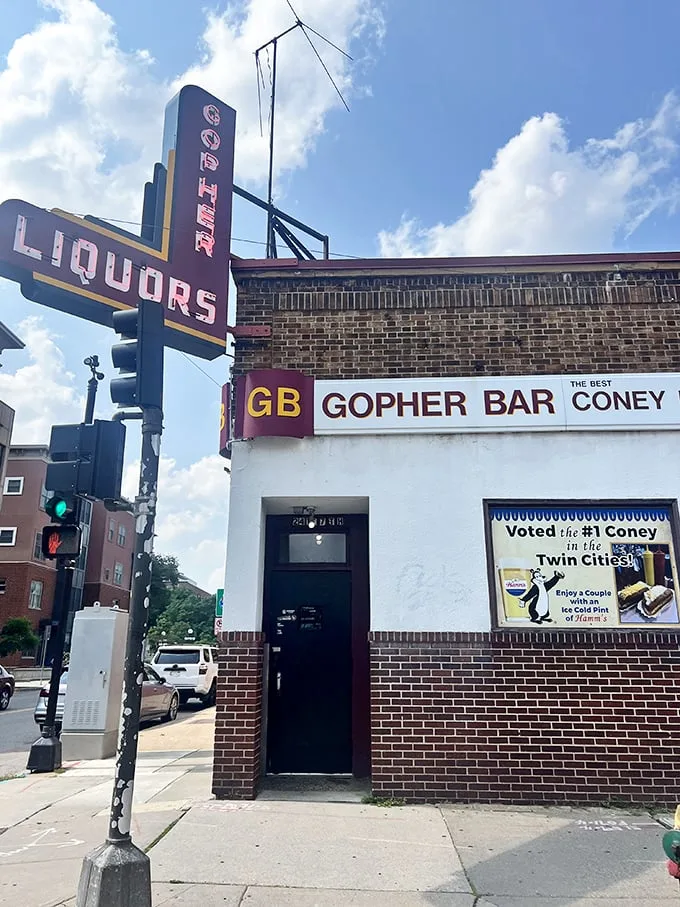 A neon beacon of hope for hungry souls! The Gopher Bar's vintage sign promises liquid courage and legendary Coneys, a siren call to comfort food seekers.