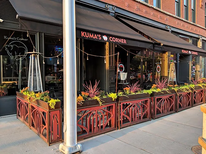 Rock 'n' roll meets comfort food! Kuma's Corner's exterior promises a flavor rebellion with its edgy signage and inviting planters.