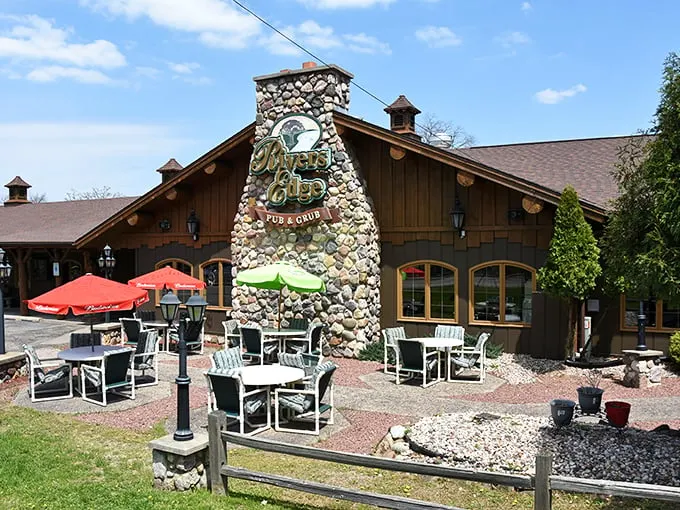 Rustic charm meets outdoor dining at River's Edge Pub & Grub, where patrons can enjoy a cozy patio experience under sunny Wisconsin skies.