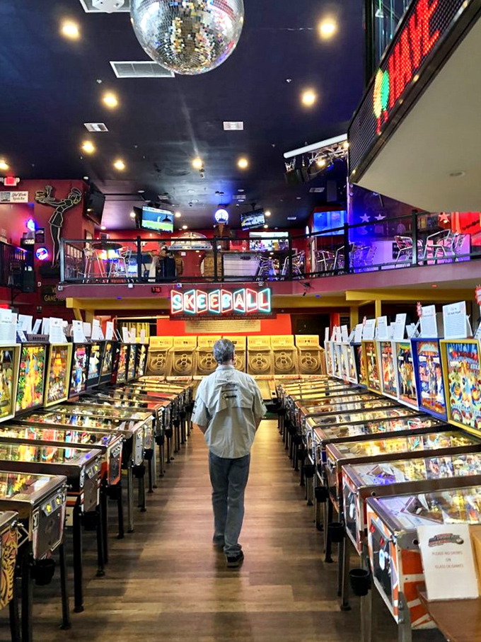 Step into a neon-drenched wonderland! This vibrant facade promises a journey back to the golden age of arcades, with a side of modern flair.