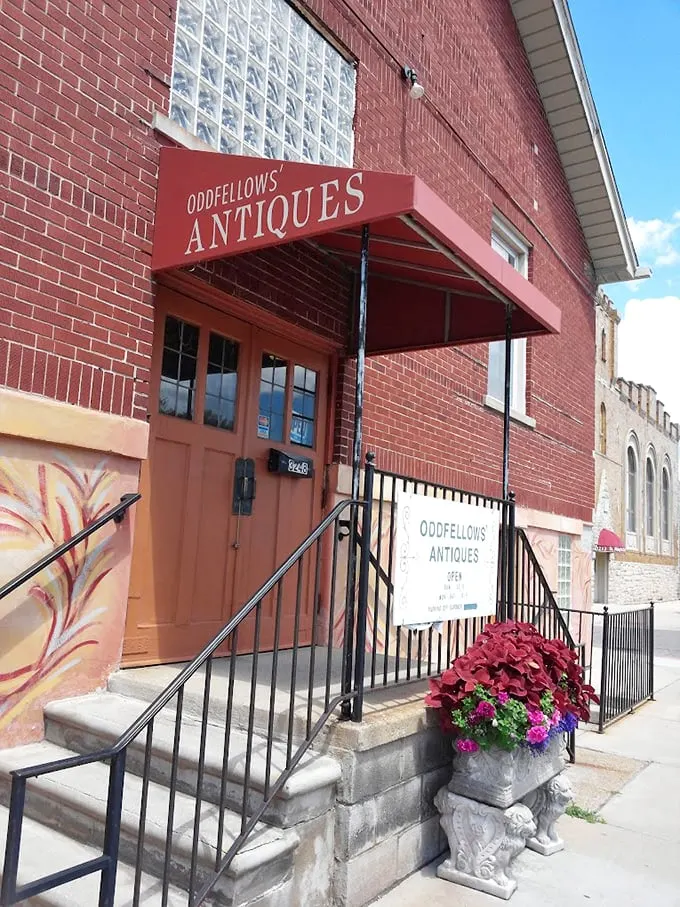 Step right up to the red brick wonderland! Odd Fellows Antiques beckons with its charming awning and promise of treasures within.