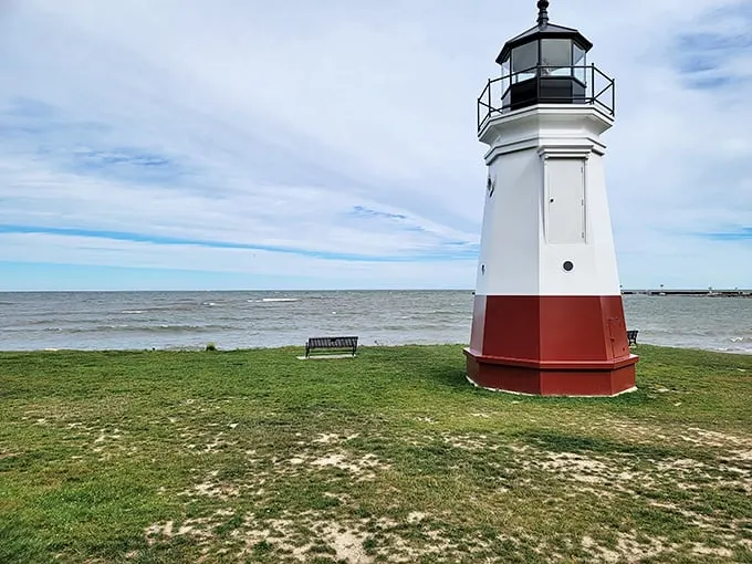 "Ahoy, landlubbers! This pint-sized beacon stands tall against Lake Erie's vastness, proving that sometimes the best things come in small, striped packages."