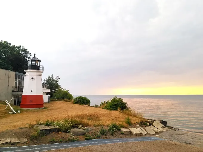 "Ahoy, landlubbers! This pint-sized beacon stands tall against Lake Erie's vastness, proving that sometimes the best things come in small, striped packages."