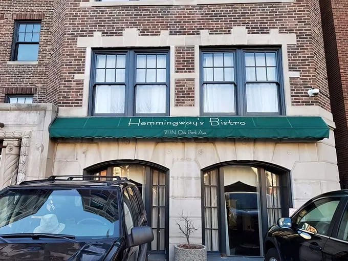 A Parisian postcard in Oak Park! Hemingway's Bistro beckons with its charming green awning and promise of culinary adventures. Who needs a passport when you've got this gem?