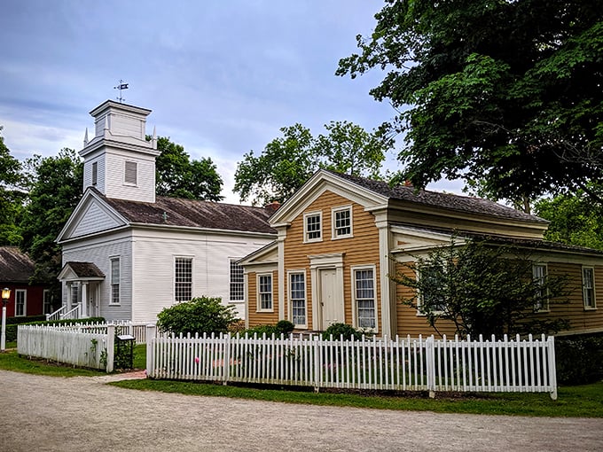 Step into a Norman Rockwell painting come to life! This pristine white church stands proudly, surrounded by vibrant flowers and picket fences – a slice of Americana that'll make you want to belt out "God Bless America."