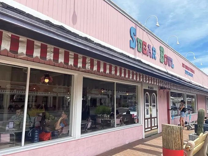 Palm trees and pink paradise! The Sugar Bowl's exterior is like a retro postcard come to life, beckoning you to step into a sweeter era.