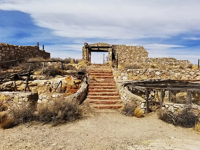 Ancient stone steps lead to a mysterious doorway, like something out of an Indiana Jones movie. Nature and history collide in this haunting entrance.
