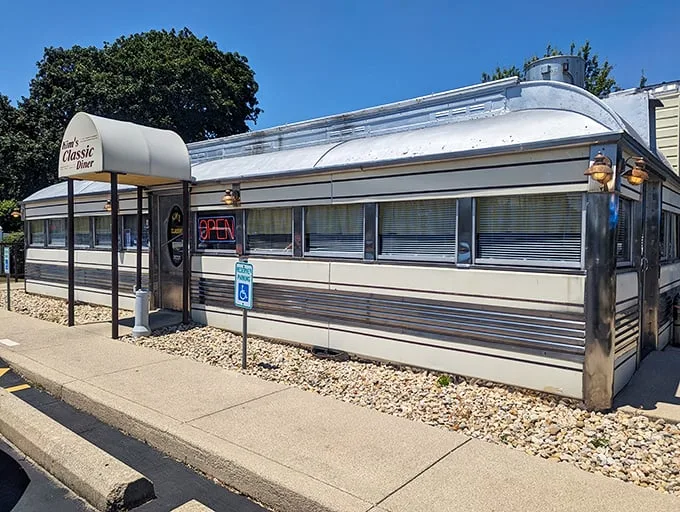 Shiny and chrome! This retro diner gleams like a time machine, ready to whisk you back to the fabulous fifties.