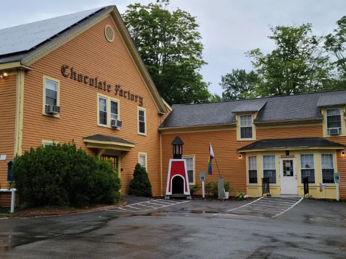 Welcome to chocolate heaven! This mustard-yellow building isn't just a factory, it's a portal to your sweetest childhood dreams.