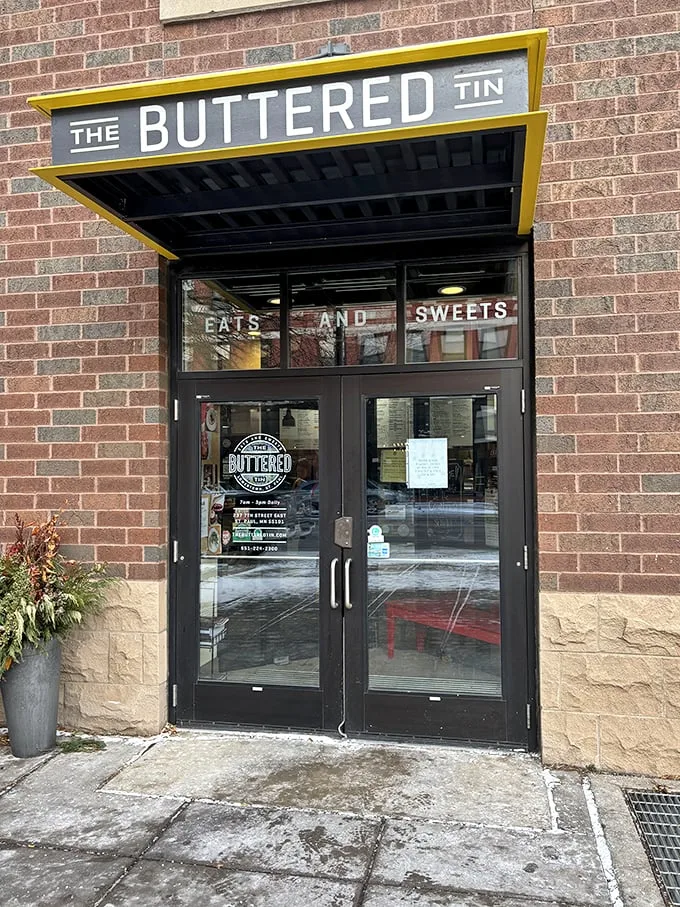 Welcome to butter paradise! The Buttered Tin's exterior promises a world of flaky, golden delights waiting just beyond those glass doors.