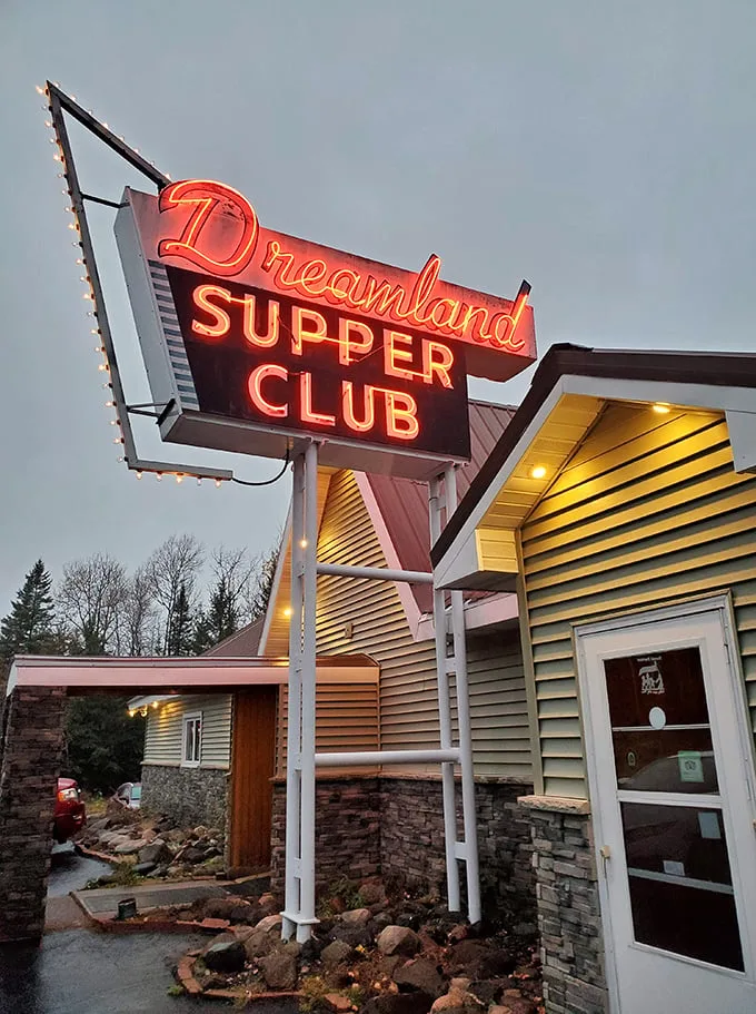 Neon dreams come true! Dreamland Supper Club's vintage sign beckons like a lighthouse for the hungry, promising a voyage through Wisconsin's culinary past.