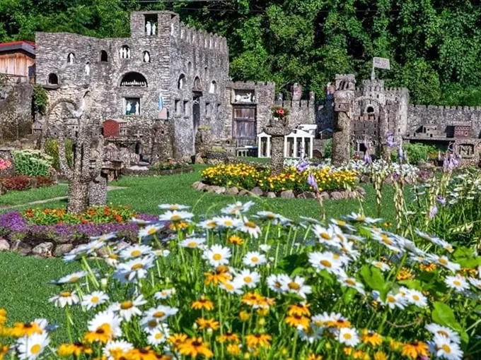 Step into a storybook world! This whimsical rock garden is like Disneyland meets "Honey, I Shrunk the Kids" – but with more charm and fewer shrink rays.