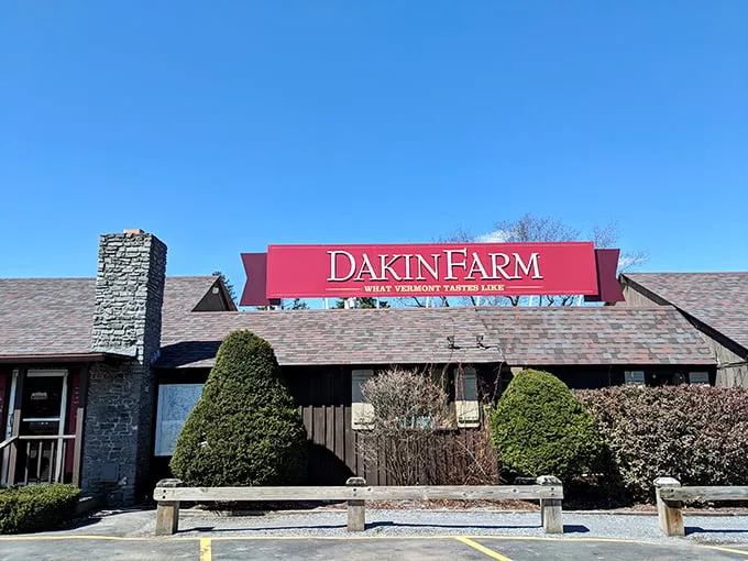 Welcome to flavor paradise! Dakin Farm's charming exterior promises a journey through Vermont's tastiest treasures. It's like Willy Wonka's factory, but with more maple and less singing.