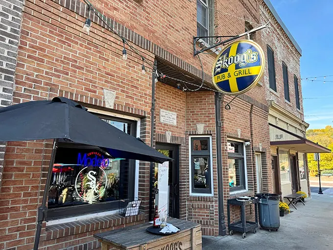 Welcome to flavor town! Skoog's Pub & Grill's inviting exterior promises a feast for the senses, with its charming brick facade and Swedish-inspired sign beckoning hungry travelers.