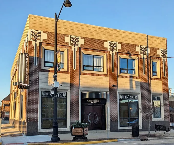 A bank heist for your taste buds! Gaetano's Vault's exterior promises a culinary adventure behind its art deco facade and mysterious "Spirits" and "Dining" windows.
