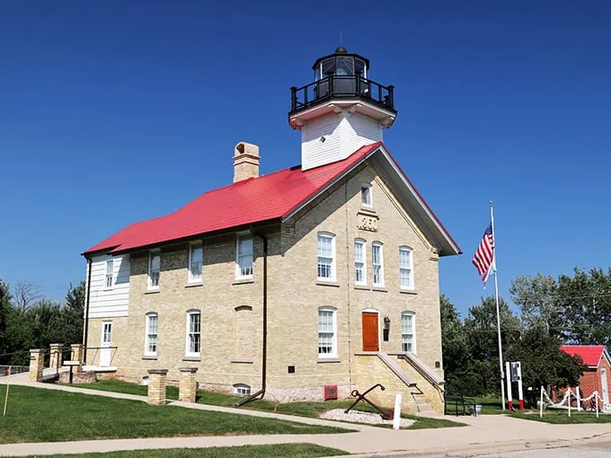 Ahoy there, lighthouse lovers! This cream city brick beauty stands tall and proud, like a maritime supermodel strutting her stuff on Lake Michigan's catwalk.
