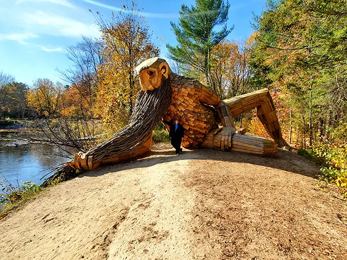 Behold, the bearded behemoth of Germfask! Benny lounges by the river, his wooden whiskers ready to tickle the imagination of every passerby.